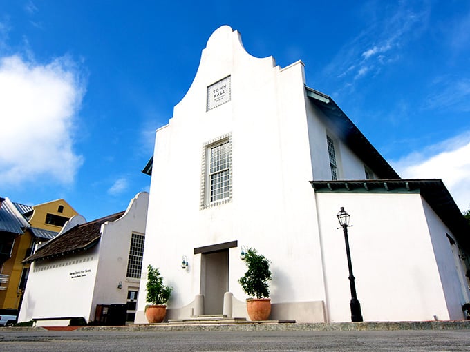 That pristine white facade against blue sky proves sometimes the most striking architecture is also the most understated.