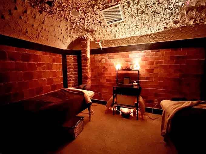 This intimate massage room glows like the inside of a sunset, wrapped entirely in healing salt.