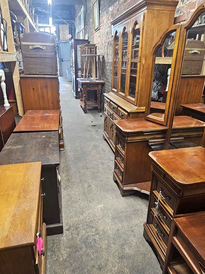Wooden furniture lined up like soldiers, each piece with more stories than your chatty neighbor at the mailbox.