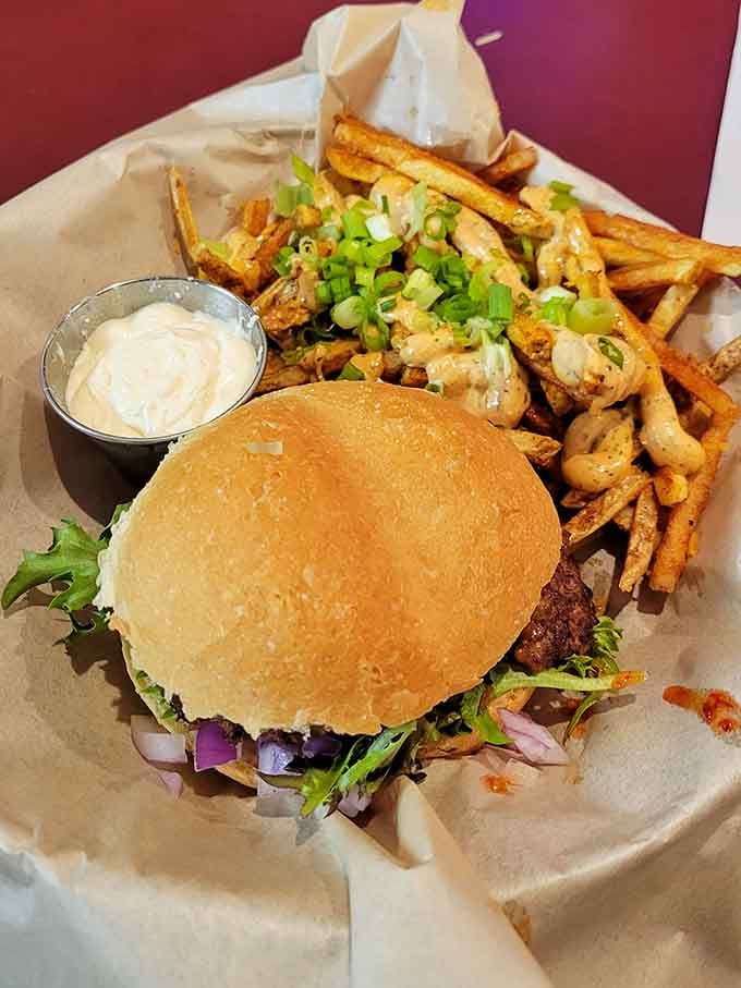 A burger piled high with shrimp and fries proves that sometimes more really is more delicious.