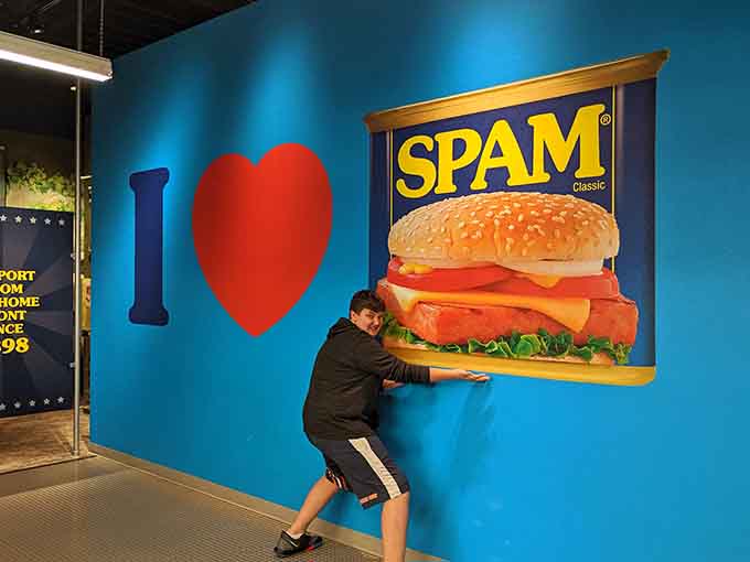 Nothing says "I love SPAM" quite like pretending to devour a sandwich bigger than your torso for posterity.