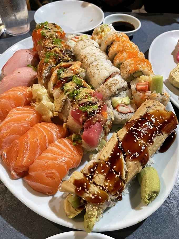 This isn't a plate, it's a sushi landscape where salmon nigiri the size of your palm roams free.