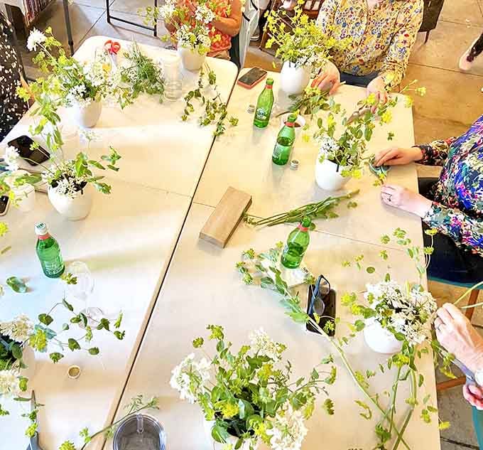 Workshop tables transform into creative studios where flowers become art and everyone channels their inner florist extraordinaire.