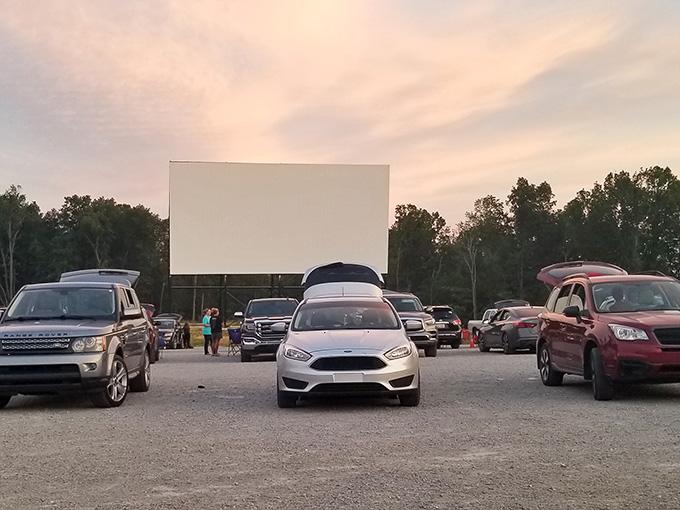 The expansive parking area awaits its nightly crowd, each spot offering a front-row view to movie magic.