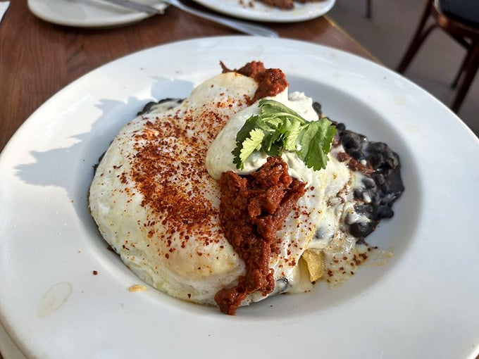 Huevos rancheros topped with perfectly cooked eggs and fresh cilantro, because mornings deserve this kind of attention.