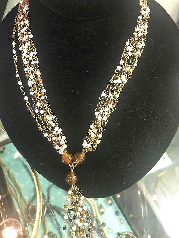 That delicate multi-strand necklace sparkles with the kind of elegance that makes people ask where you got it.