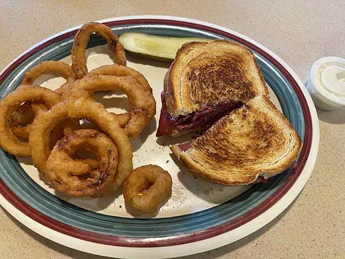 That patty melt with onion rings looks like it could solve most of life's problems, or at least distract you from them.
