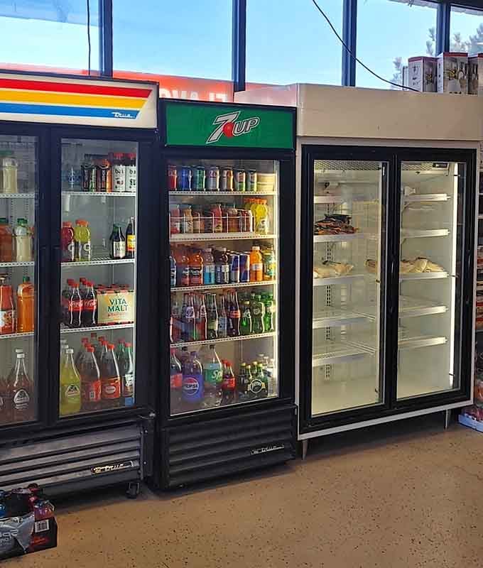 The beverage coolers hold liquid adventures, each bottle a passport stamp you can earn without leaving Colorado's altitude.