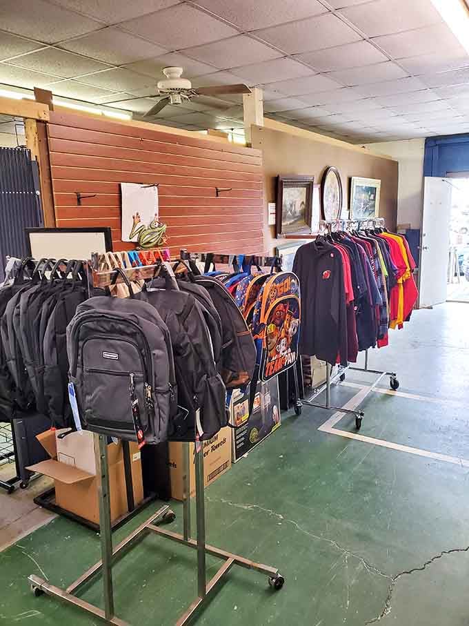 Backpacks and colorful tees fill the indoor space where practical meets playful in perfect harmony.