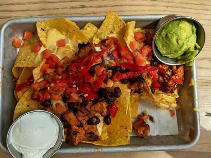 Loaded nachos done right, because sometimes you need melted cheese and guacamole to make life make sense again.