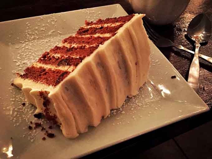 Carrot cake so towering it makes you wonder if vegetables really count when they're buried under cream cheese frosting.