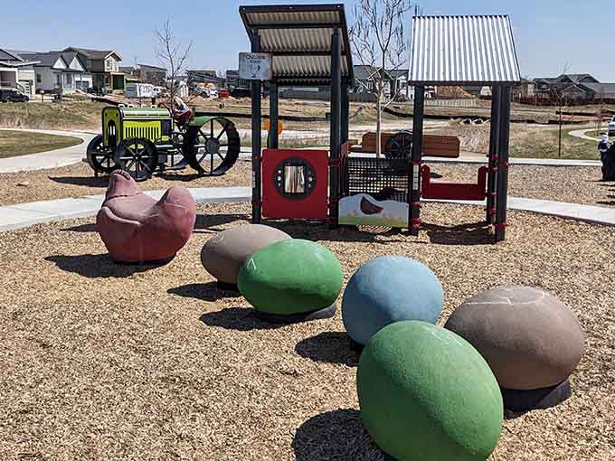 Giant colorful eggs scattered across the playground because apparently chickens lay rainbow treasures here.