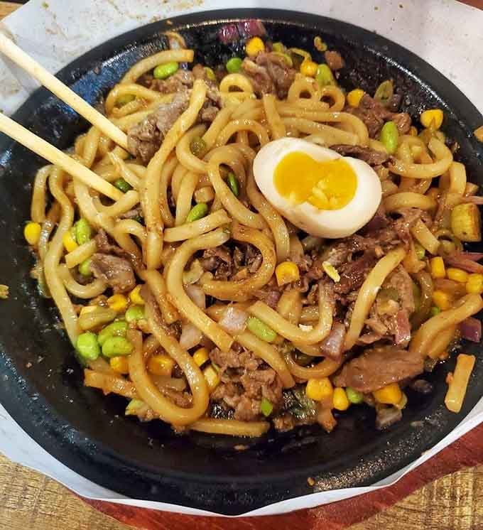 Noodles, beef, soft-boiled egg, and enough toppings to make you forget you're technically eating a balanced meal.