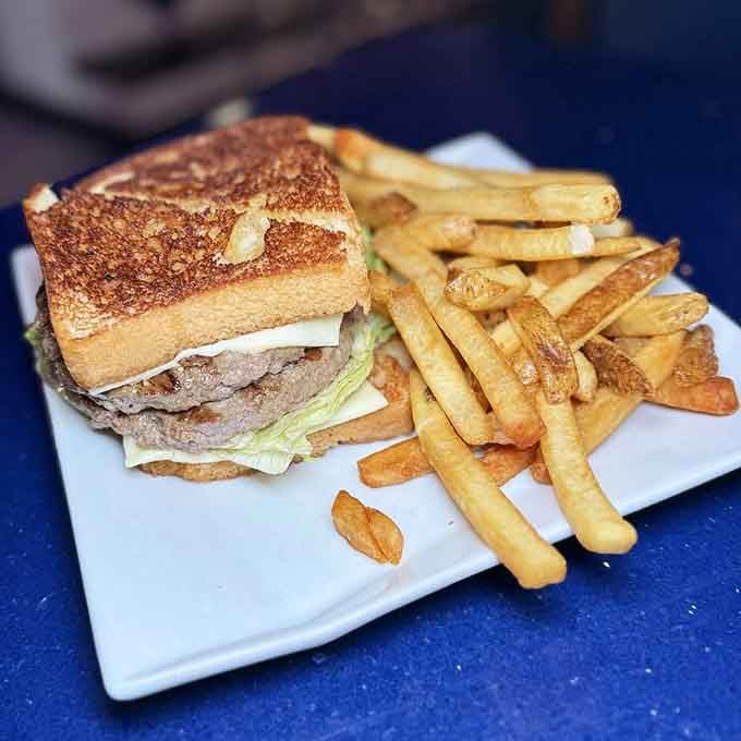 A patty melt grilled to golden perfection with a mountain of fries is comfort food's greatest achievement.