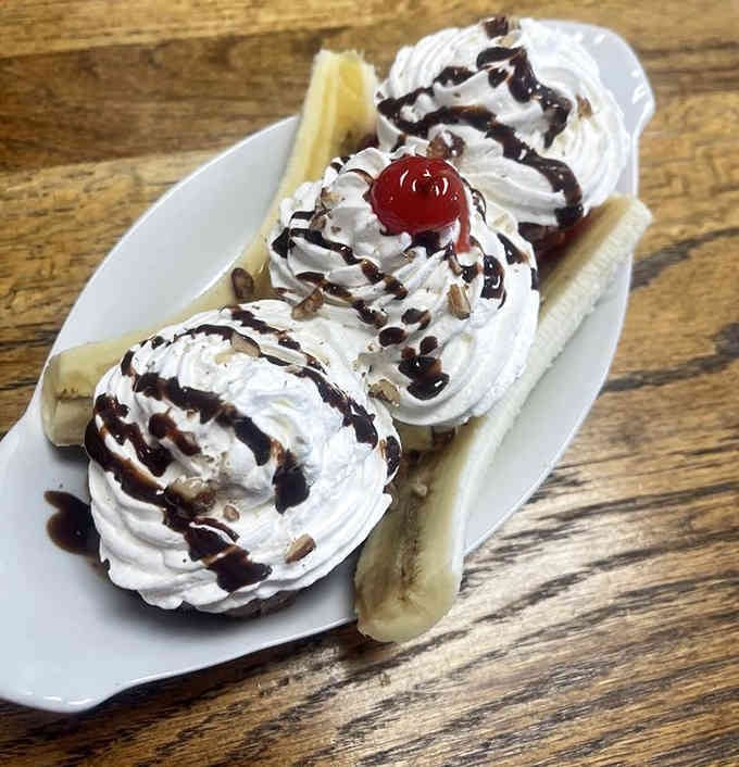Three scoops of happiness arranged on a banana boat that could double as a life raft for your diet.