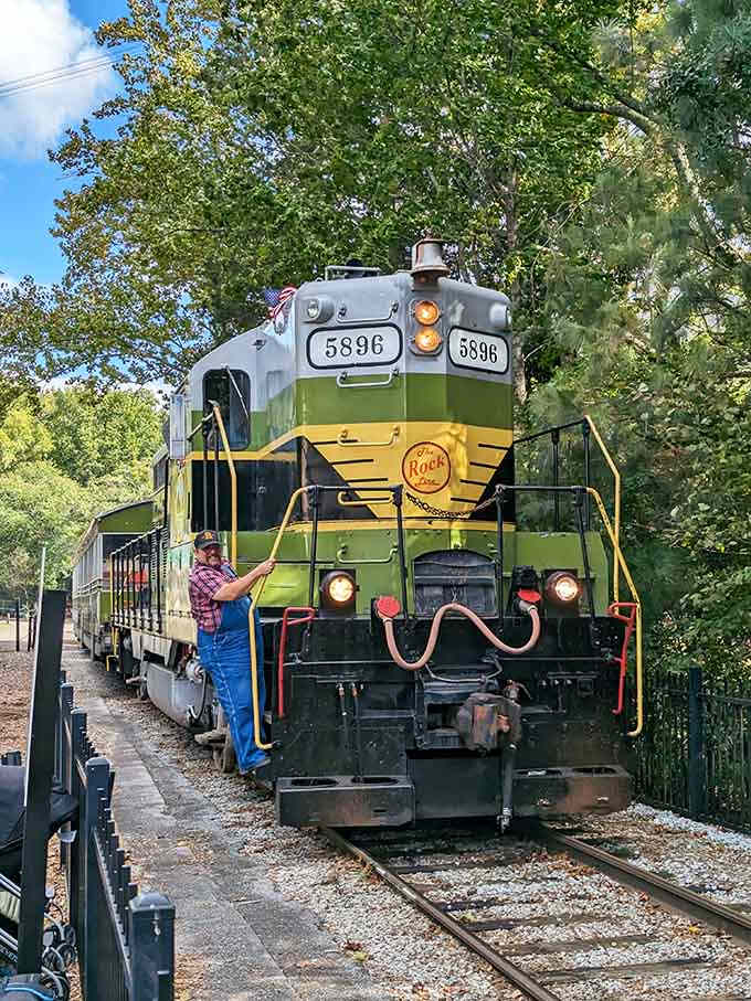 The vintage locomotive stands ready like it's been waiting just for you to climb aboard today.