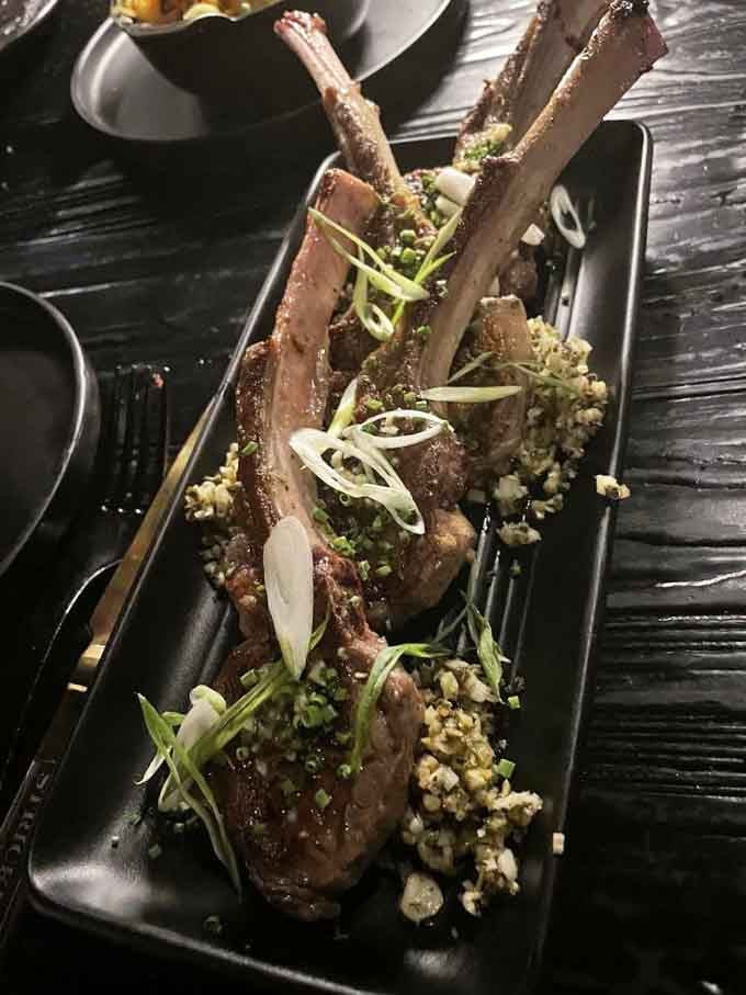 These lamb chops arrive dressed to impress, proving that presentation matters almost as much as flavor does here.