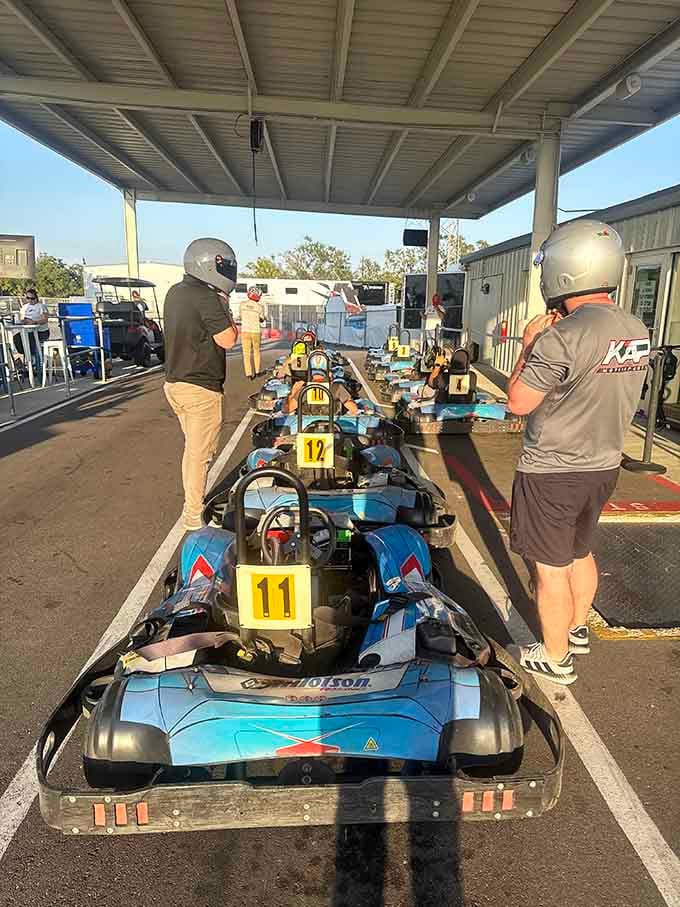 Golden hour shadows stretch across the pit lane as drivers prepare their machines for another round of friendly competition.