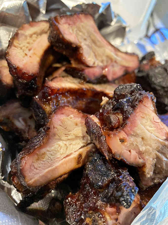 Baby back ribs with that perfect caramelized crust that only comes from hours of patient, low-and-slow smoking.