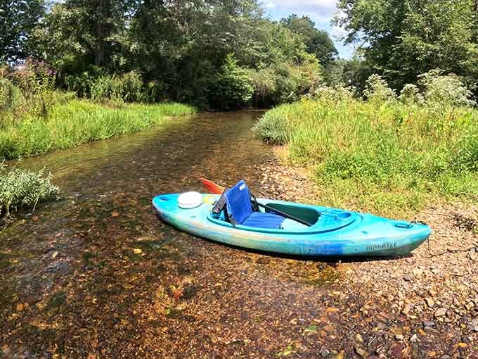 That lonely kayak waiting on the shore is basically begging you to grab a paddle and go.