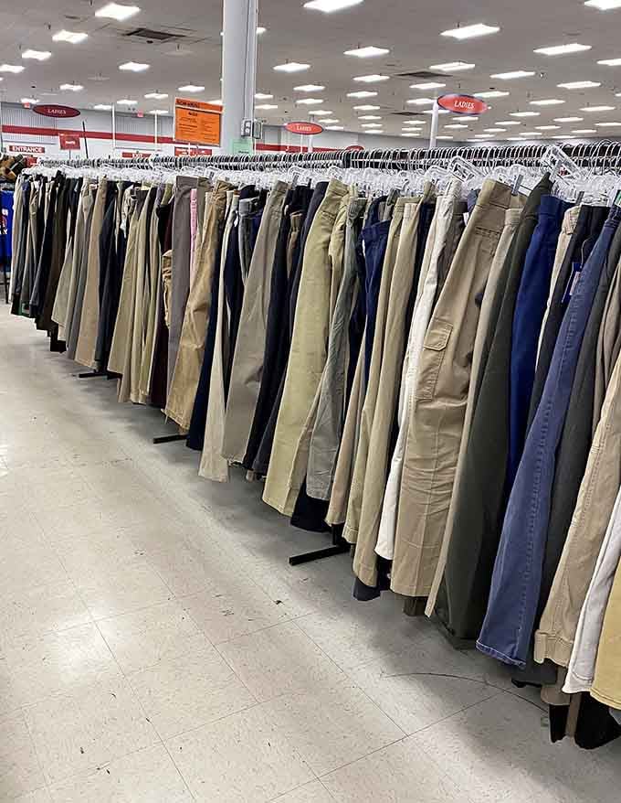 Pants organized by style and color stretch into the distance, proving thrift shopping doesn't mean chaos.