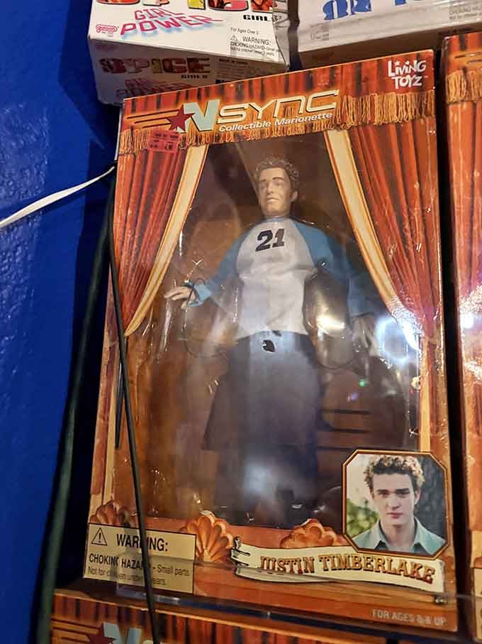 Yes, that's an NSYNC collectible figure, because apparently everything from the late '90s is now museum-worthy memorabilia.