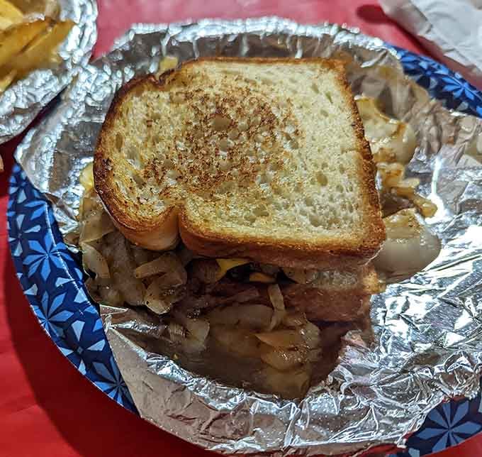 The patty melt arrives wrapped like a gift, because sometimes the best presents come on toasted bread.