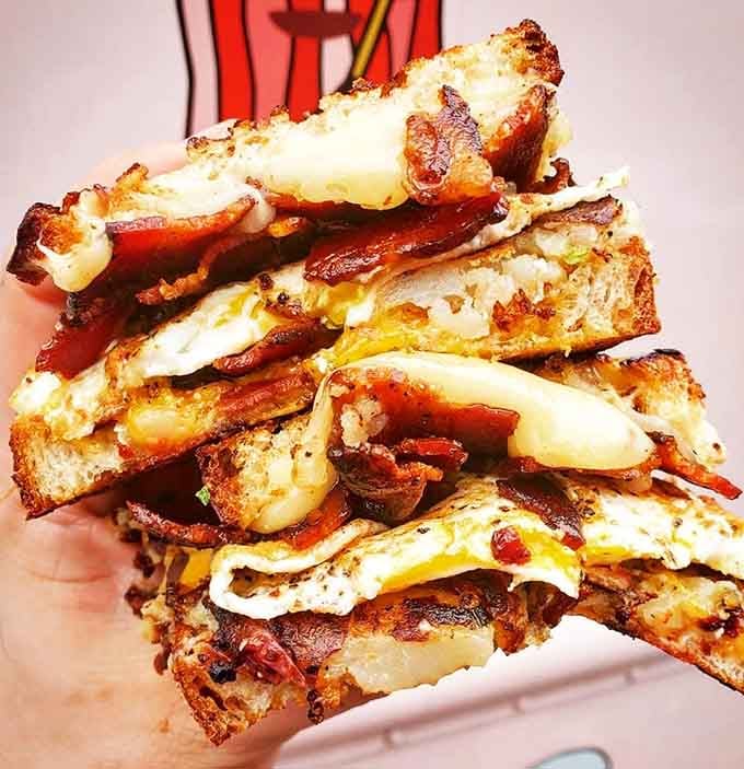 This towering stack of crispy bacon sandwiches proves that sometimes more is more, and restraint is overrated entirely.