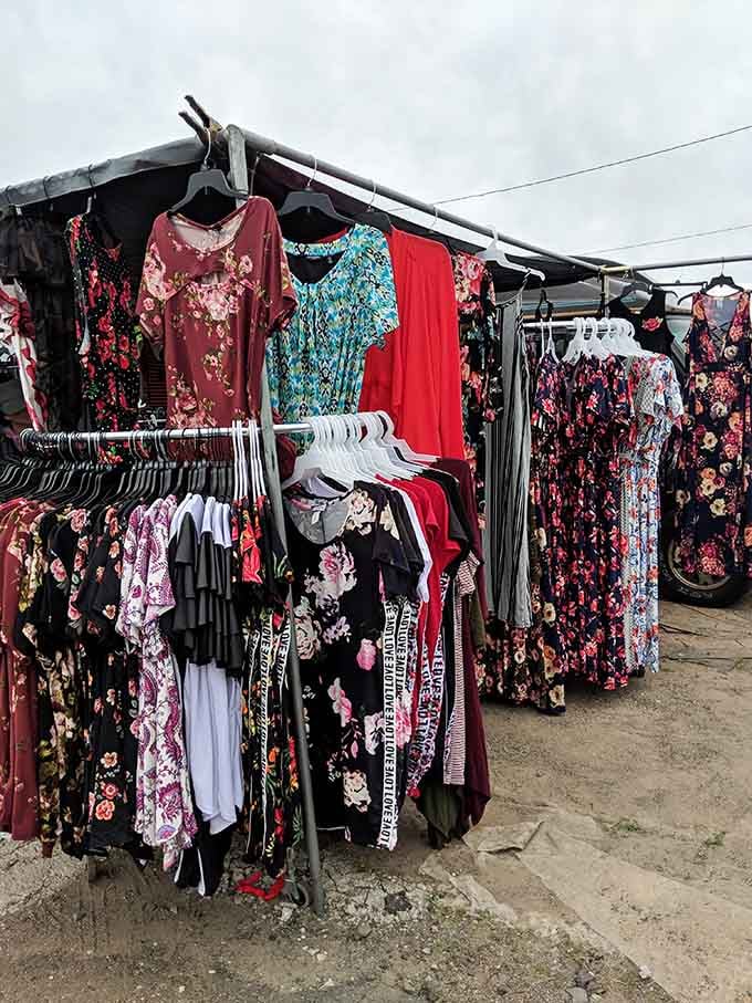 Floral prints bloom across racks of dresses that bring garden party vibes to outdoor shopping.