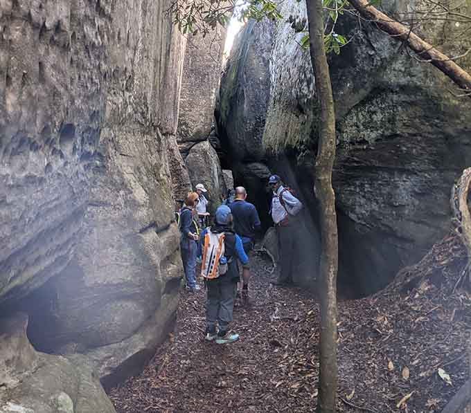 Squeezing through these narrow rock passages feels like exploring an ancient stone fortress built by giants.