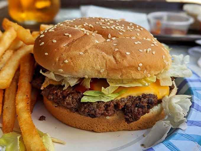 Sesame seed bun, charred patty, melted cheese: the holy trinity of burger perfection achieved through fire.