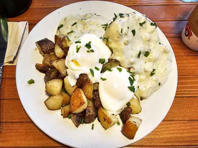Biscuits drowning in gravy with poached eggs on top, because sometimes more really is more in the best way.