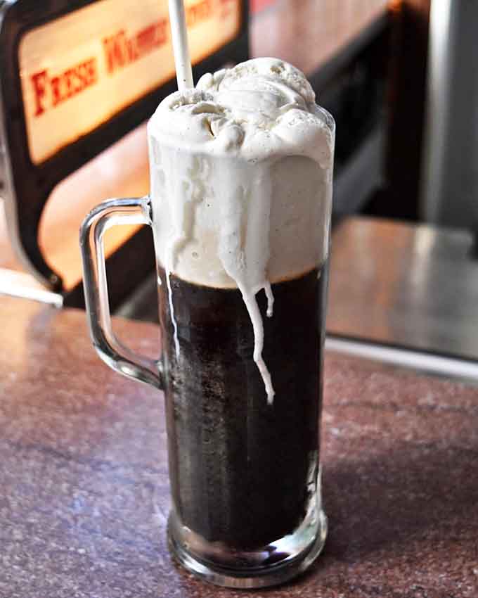 A root beer float so tall it needs its own zip code, served in proper glassware like civilized people.