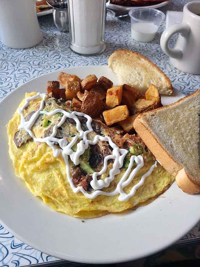 That omelet is so fluffy it could double as a pillow, if pillows were delicious and filled with vegetables.