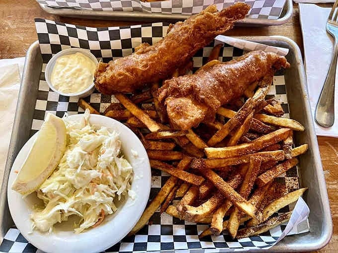 Golden, crispy fish and chips served with coleslaw&mdash;comfort food that's been perfecting itself for generations here.