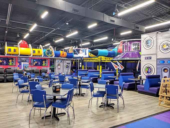 Blue chairs arranged like a cafeteria suggest birthday cake and celebration, minus the cleanup at home.