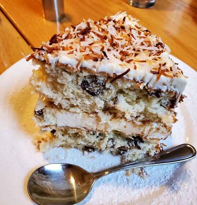 Layers of coconut cake topped with toasted flakes create pure heaven on a plate.