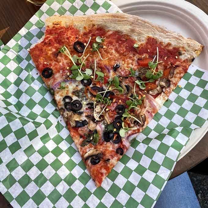 Fresh veggies and melted cheese combine in a slice that's both photogenic and genuinely delicious to eat.