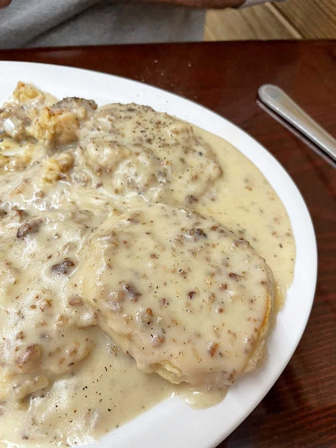 Biscuits drowning in sausage gravy with a side of hash browns is Southern comfort food at its absolute finest.