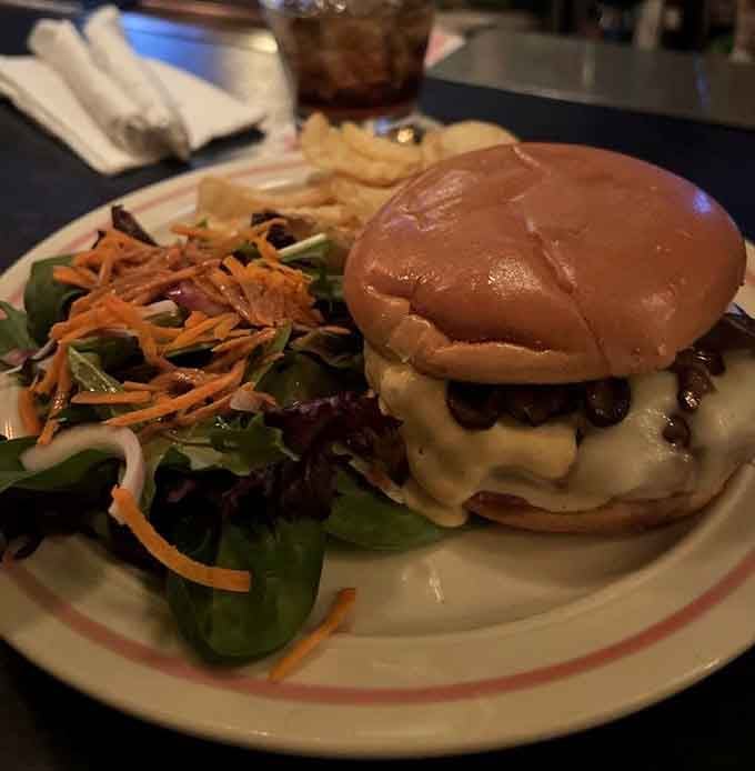 That burger's melted Swiss and mushroom situation could make a vegetarian reconsider their entire life philosophy right now.