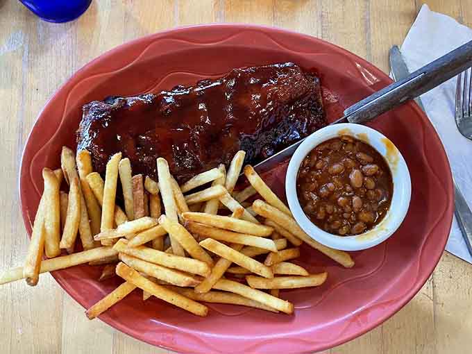Ribs glazed to mahogany perfection, the kind that make you forget every other rack you've eaten.