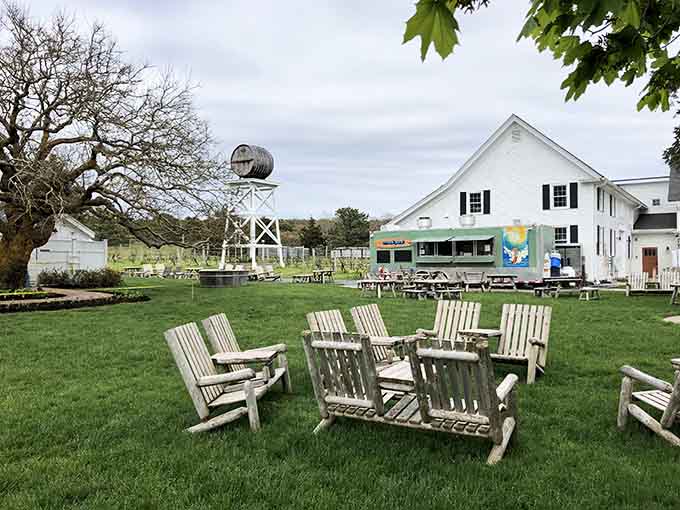 Adirondack chairs await on the lawn, inviting you to sit, sip, and savor the good life Cape Cod style.