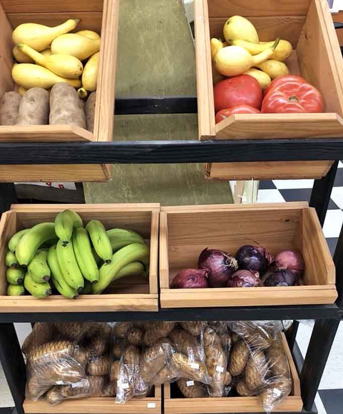 Fresh produce displayed in wooden crates proves that even vegetables look better when they're presented with mountain charm.
