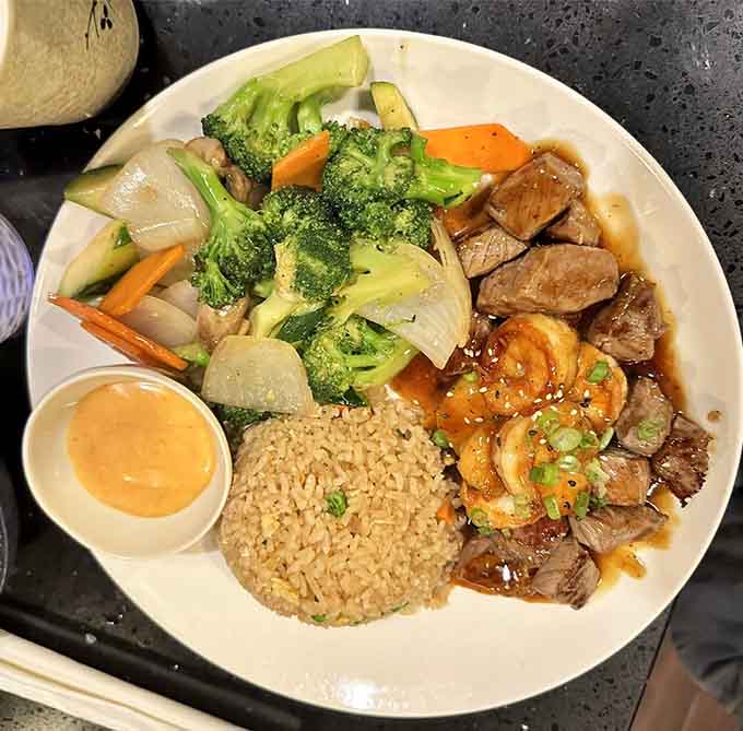 Perfectly grilled steak and shrimp alongside crisp vegetables proves that hibachi done right never goes out of style.