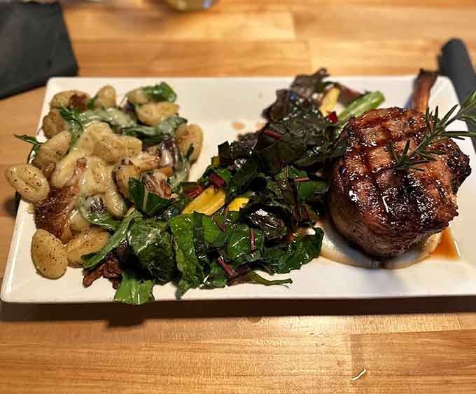 A perfectly seared pork chop paired with greens and gnocchi proves pub food can be downright elegant.
