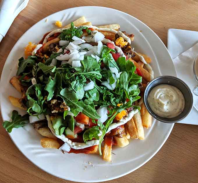 Kapsalon translates to "hair salon" in Dutch, but this loaded fries dish is way better than small talk.