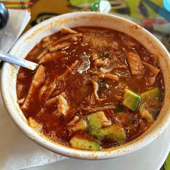Chicken tortilla soup so rich and hearty, it could probably solve at least three of your current life problems, maybe four.