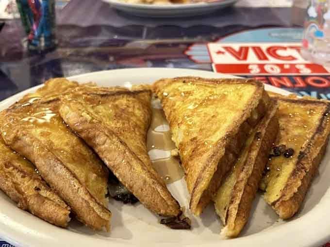 Golden French toast triangles glistening with syrup, proving banana bread had the right idea all along.