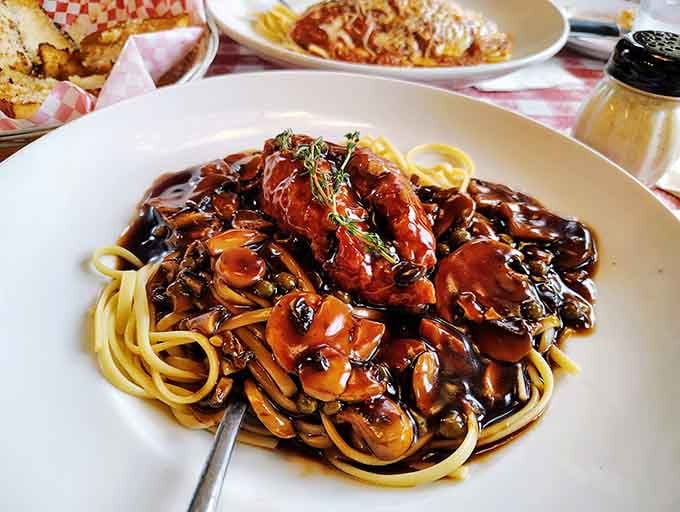 Chicken Marsala with mushrooms swimming in sauce that could make a vegetarian reconsider their entire life philosophy here.