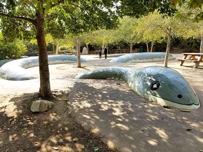 This serpent sculpture invites climbing adventures, making it infinitely cooler than any plastic slide from a catalog.